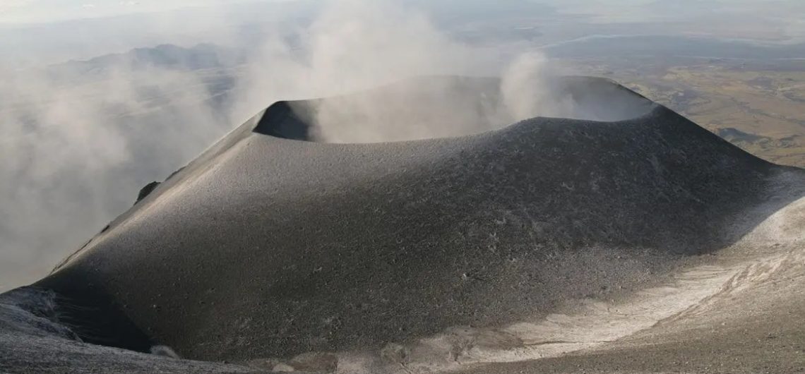 Ol Doinyo Lengai, the strange mountain of God spewing carbonatite black lava that turns white